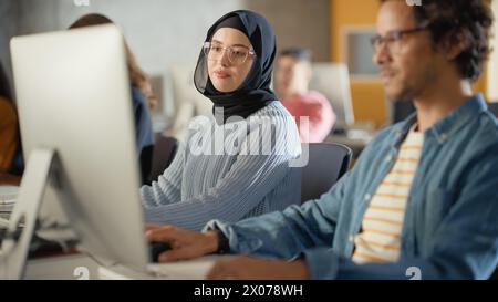 Curious Female Muslim Student Wearing a Hijab, Studying in Modern ...