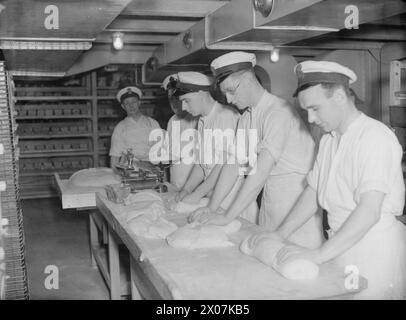 THE DAILY ROUTINE OF HMS TYNE, A DESTROYER DEPOT SHIP. FLEET ANCHORAGE ...