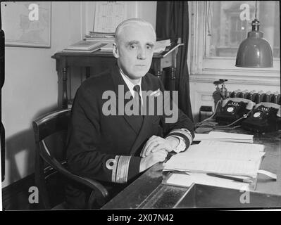 REAR ADMIRAL E J P BRIND, CBE, IN HIS CABIN. MARCH 1945 Stock Photo - Alamy