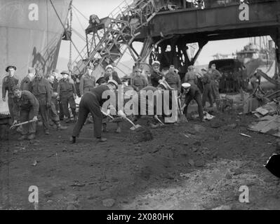 THE NAVY LENDS A HAND AT BONE: REPAIR WORK ASHORE AFTER ALL NIGHT ACTION. 26 AND 28 NOVEMBER ...