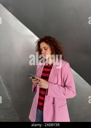Young redhead woman over grey grunge wall with open hand doing stop ...