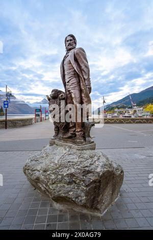 A detailed bronze sculpture depicting historical figures in traditional ...