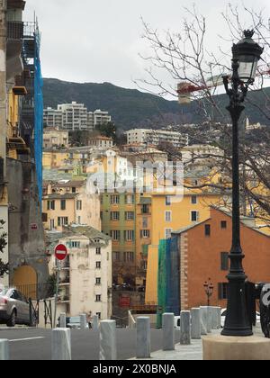 Bastia, France. 24th Feb, 2024. A woman sits on a wall on the promenade ...