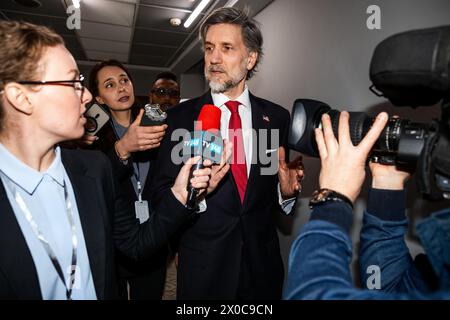 Busy republican politician walks in government building, answers press ...