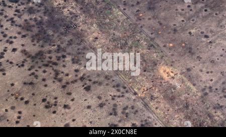 Funnels from artillery explosions cannon shells on the ground: top view ...