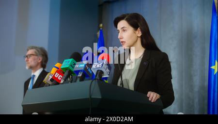 Confident politician makes an announcement, answers media questions and ...