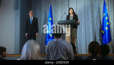 Female politician comes to tribune, delivers campaign speech, answers ...