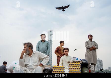 Afghan Muslims buy yellow eggs during the Eid al-Fitr celebration ...