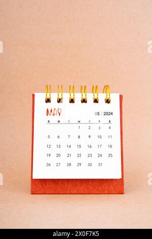 2024 May brown desk calendar on black background Stock Photo - Alamy