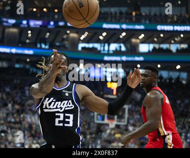 Sacramento Kings guard Keon Ellis (23) and Denver Nuggets guard Tim ...