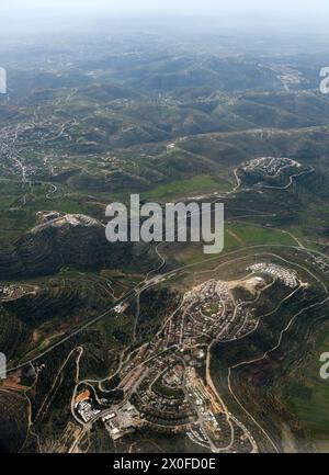 Aerial view of Israeli settlements and Palestinian villages in Judea ...
