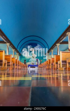Multi colored Interior of main church of La Fortuna de San Carlos ...