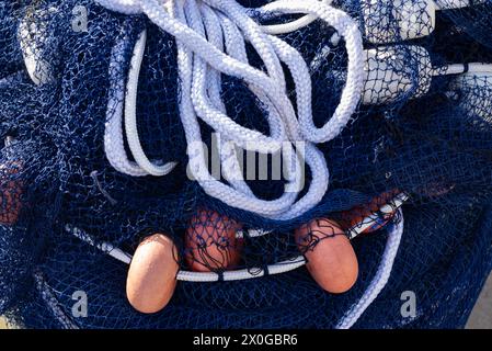 A balled-up blue professional fishing net. Fishing and leisure Stock ...
