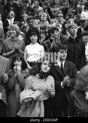 "Visitors during the Beatles concert in Essen, Germany: The police take ...