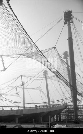 Grandstands and roof construction during rope tensioning. [automated ...