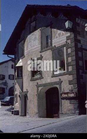House in typical Engadine style with sgraffito technique. [automated ...