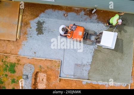Self dumping track concrete buggy is used to pour wet cement into ...