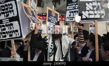A Haredi Jew wrapped with Talit shawl and Tefillin, or phylacteries ...