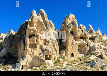 Ancient cave dwellings carved into limestone rocks. Fairy chimney in ...