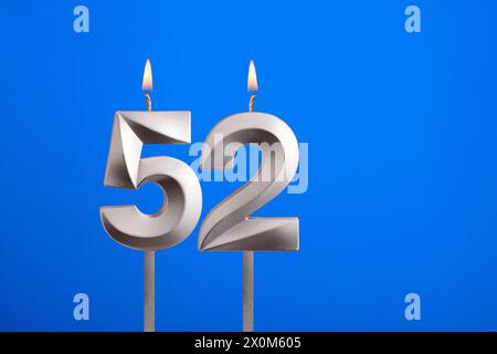 Lit birthday candle - Candle number 52 on white background Stock Photo ...
