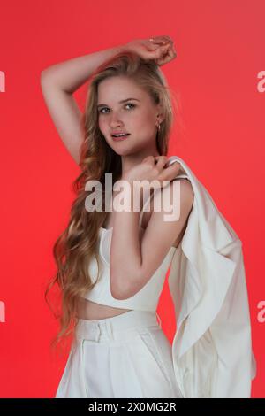 Young beautiful caucasian woman over isolated background with a big ...