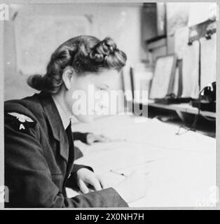 W.A.A.F. METEOROLOGISTS AT WORK - WAAF meteorologists plotting pressure ...