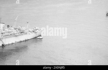 In August 1943 at Freetown, a former luxury liner converted to a HM ...