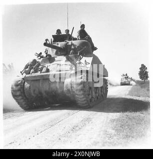 EIGHTH ARMY ADVANCE - A Sherman tank moving in pursuit of the ...