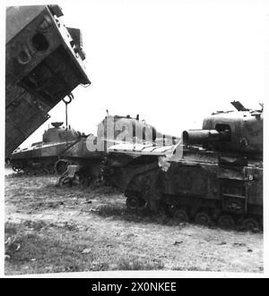 A DUMP FOR DAMAGED VEHICLES IN NORMANDY - An amphibious tank among the ...