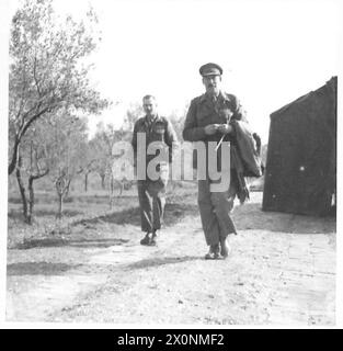 General Sir Oliver Leese of the Eighth Army is seen reading the '8th ...