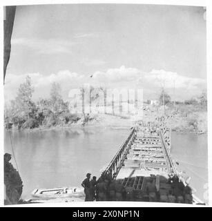 Royal Engineers of the Fifth Army push a raft into the Volturno River ...