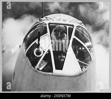 A member of the Royal Air Force Coastal Command ground crew prepares a ...