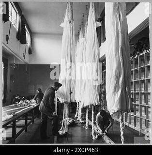 Photograph showing an RAF engineer officer supervising aircraft repairs ...