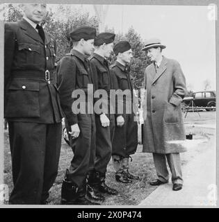 Prime Minister Harry Hopkins visiting an RAF station, speaking with ...
