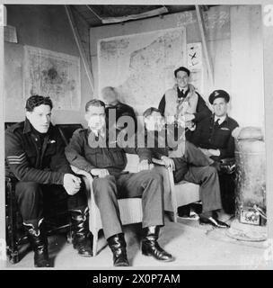 Pilots of No. 457 Squadron, an Australian fighter squadron, are shown ...