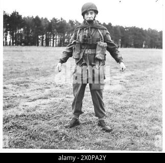 Parachutists equipped with jumping jackets, X-type parachutes, and ...