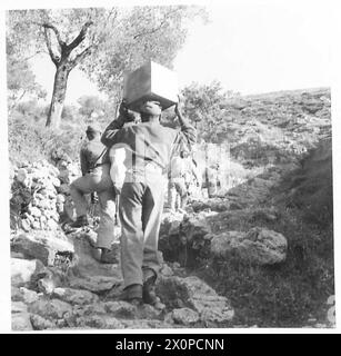 Photograph of pioneers of the Fifth Army carrying supplies up a ...