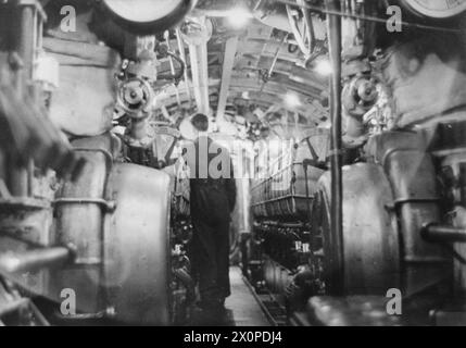 The engine room of HM Submarine Tribune is shown at Scapa Flow in July ...