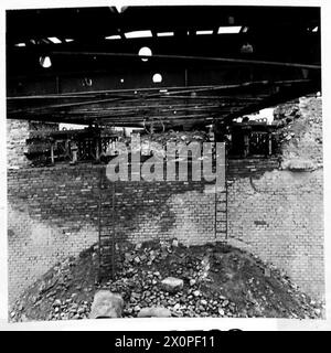 Royal Engineers construct a bridge using pile drivers and other ...
