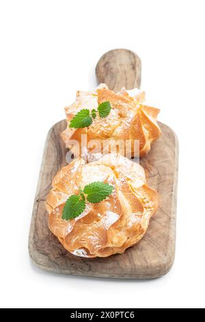 Shu eclairs cake isolated on white background Stock Photo - Alamy