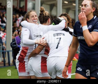 Abby Dow of England Women celebrates her try with teammates during the ...
