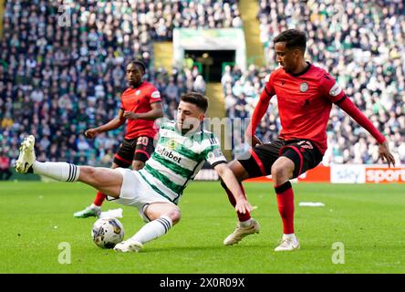 St Mirren's Keanu Baccus (left) has an attempt at goal during the ...