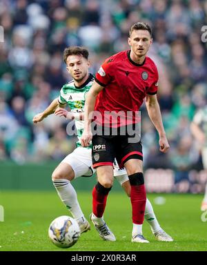 Celtic's Nicolas Kuhn (left) and St Mirren's Scott Tanser battle for ...