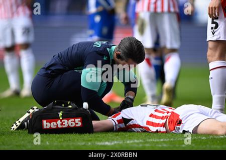 Wouter Burger of Stoke City is treated for a head injury during the Sky ...