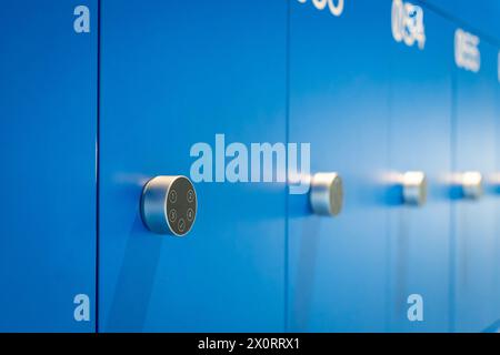 Row of blue lockers with number locks Stock Photo - Alamy