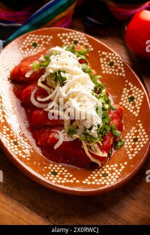 Entomatadas. Also known as Enjitomatadas, a typical dish of Mexican ...