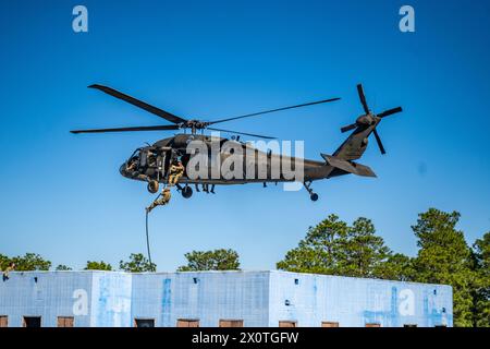 2024 Best Ranger Competition competitors fast rope from a UH-60 ...
