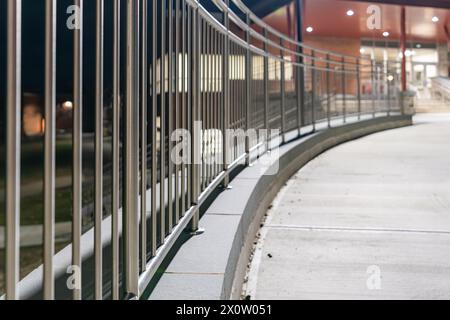Example of a stainless steel railing along an exterior set of stairs at ...