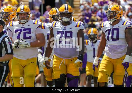 LSU offensive lineman Garrett Dellinger runs through drills during the ...