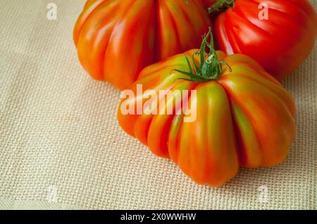 Three raf tomatoes. Close view Stock Photo - Alamy